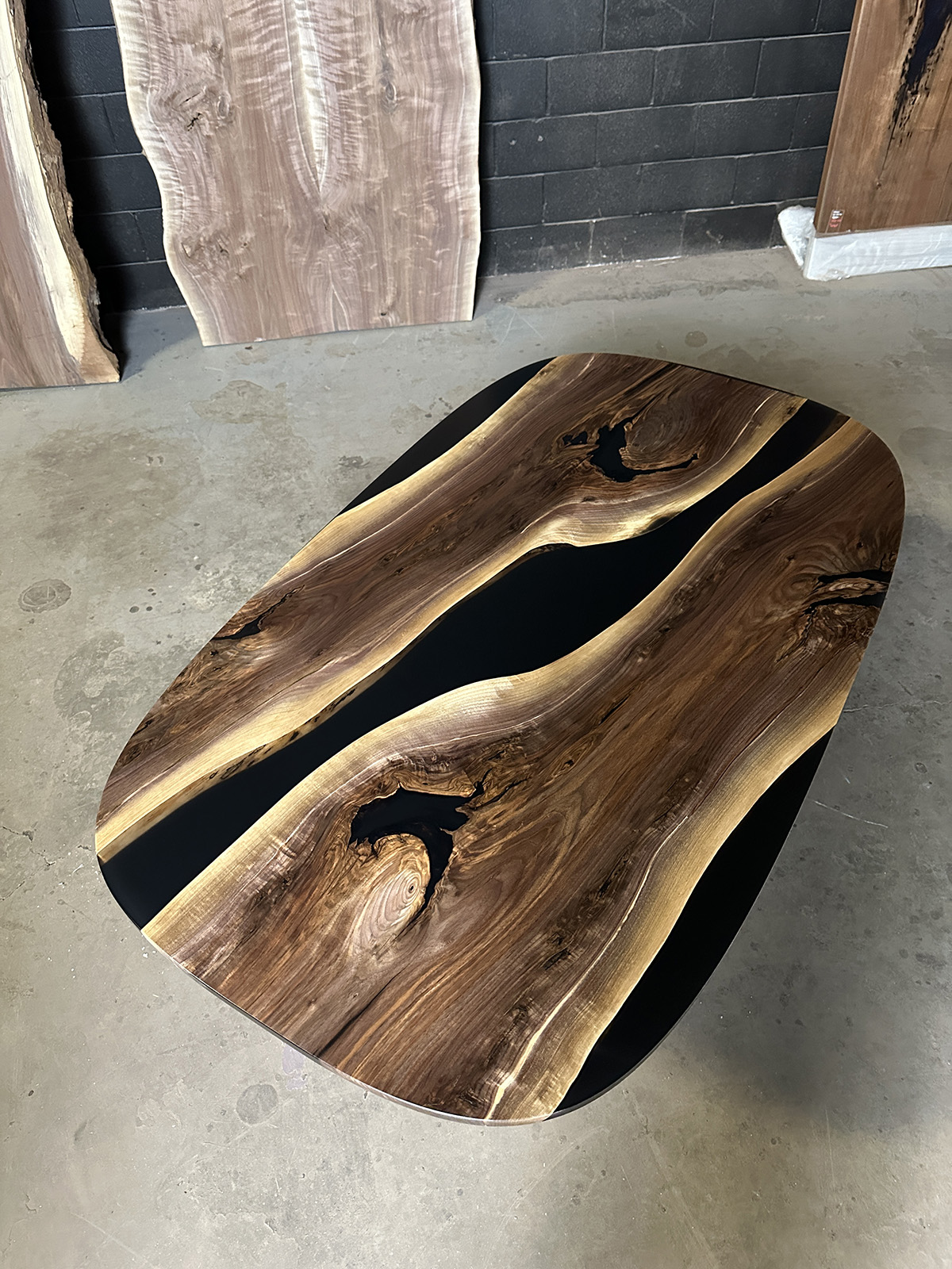 Oval Walnut Dining Table - Black Epoxy - Anglewood Furniture